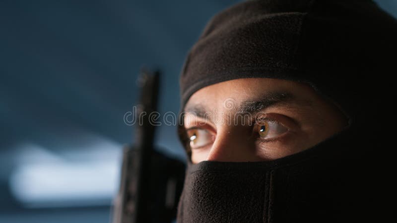 Close Up of Masked Insurgent Inspecting Room Capturing Enemy Base Stock ...