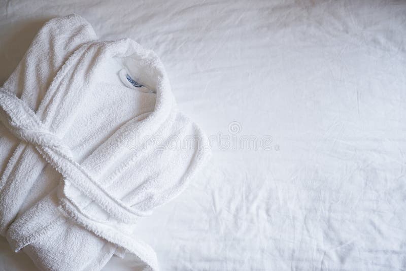 Terry White Bathrobe on the Bed, with Space for Text, Top View. the ...