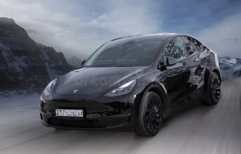 Tesla black electric car. editorial image. Image of clouds - 268889805