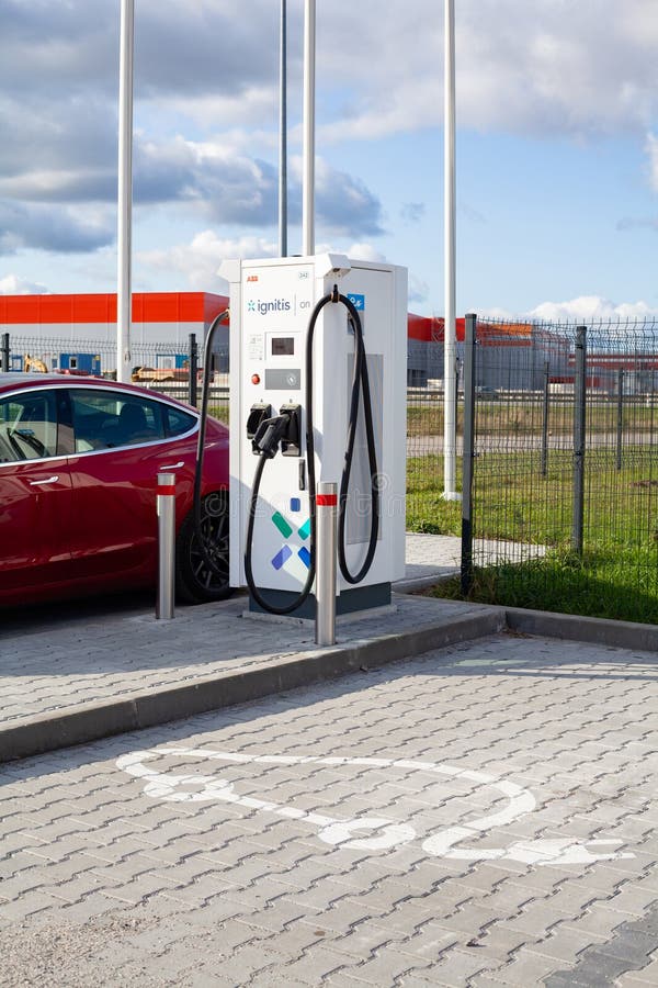 Charging Spot at Charging Station Ignitis on Next To Tesla Editorial ...