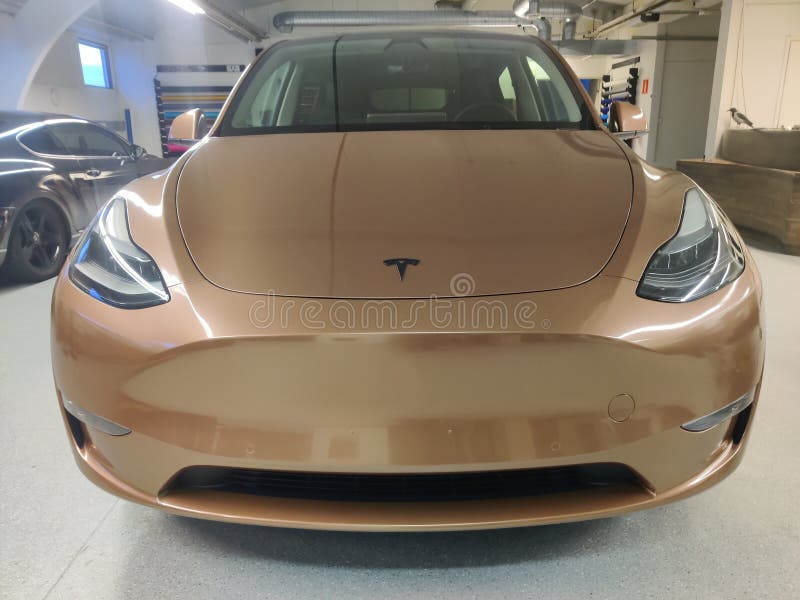 Tesla Modely Wrap Bronze Car Editorial Image - Image of wrap, tesla ...