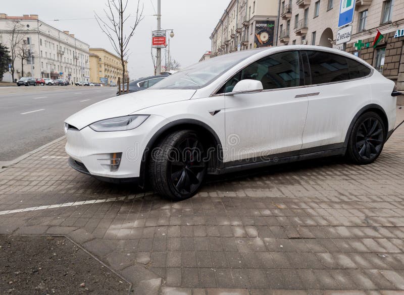 Tesla parked on street editorial image. Image of motor - 368459085