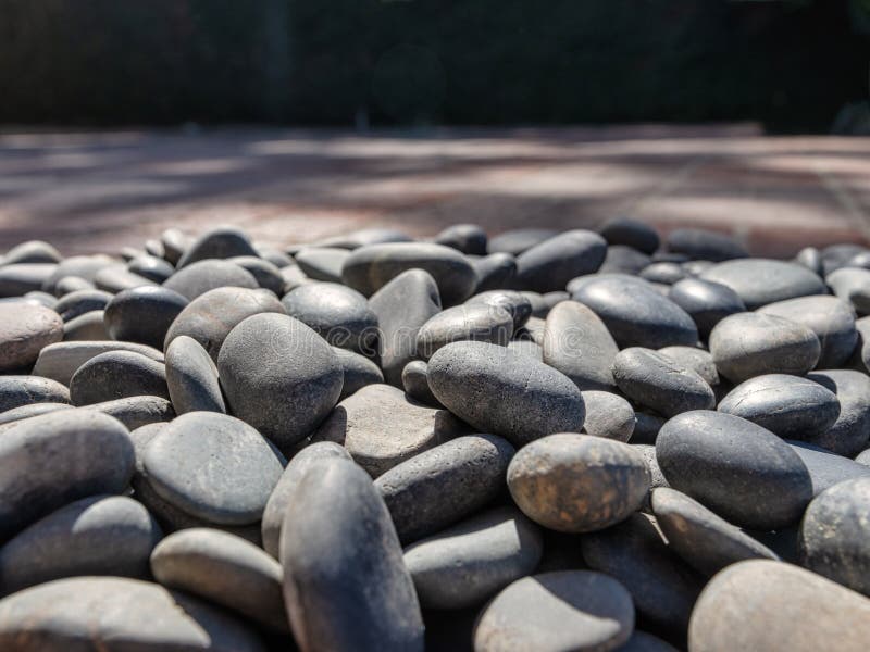 River Stones Low Angle ECU Perspective Across Stones To Mottled Shade ...