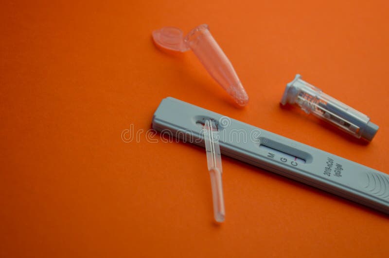 Test for Coronavirus on an Orange Background. on a Matte Background, a ...