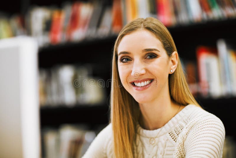 This Test is Going To Be Easy. a Cheerful Young Woman Working on a ...