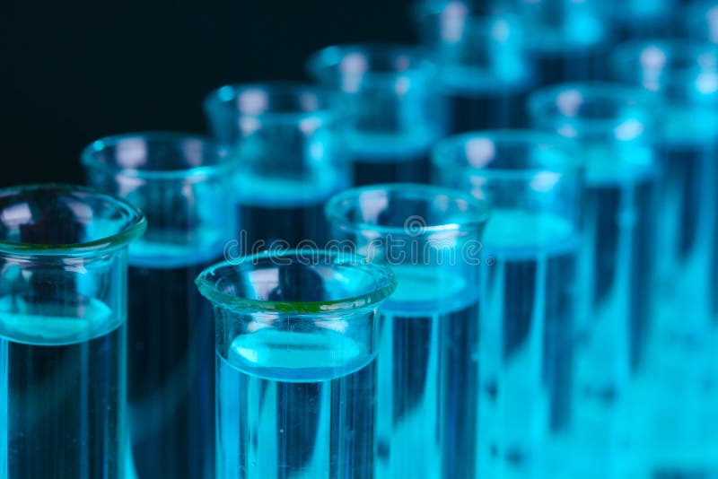 Test Tubes With Light Blue Liquid In Rack Isolated On White Stock Photo ...