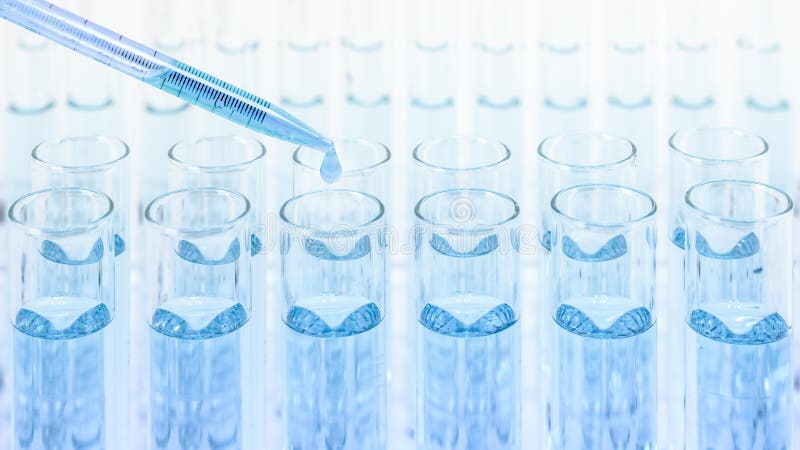 Test Tubes with Dropper Drop Some Blue Liquid in Laboratory Stock Image ...