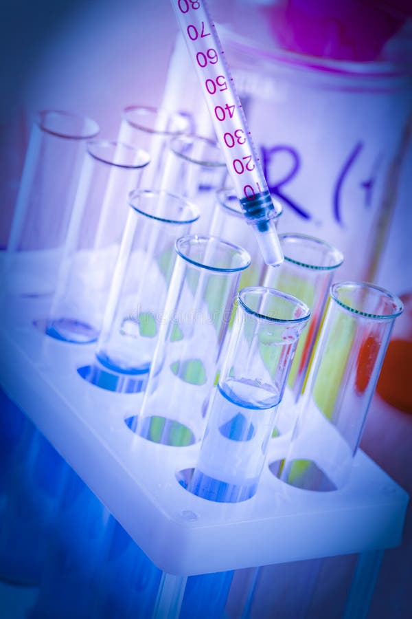 The Test Tubes and Flasks with Colored Liquid in a Laboratory Stock ...