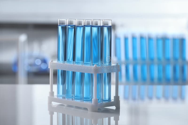 Test Tubes with Light Blue Liquid on Table in Laboratory Stock Photo ...