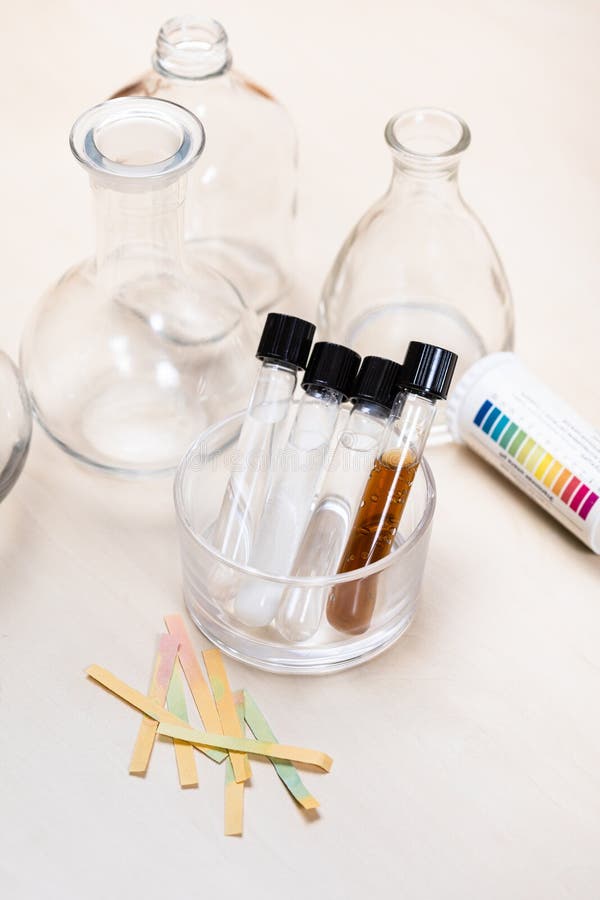 Test Tubes with Liquids, Flask and Indicator Paper Stock Image - Image ...