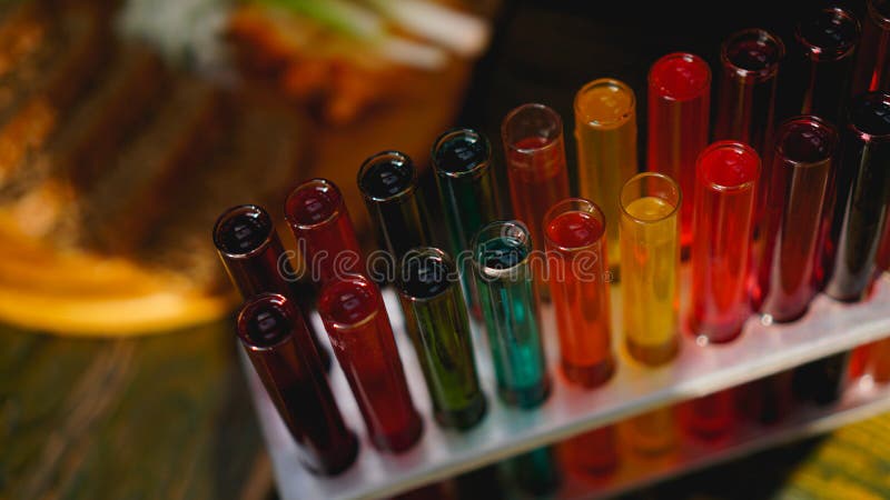 Test Tubes with Multi-colored Liquid. Alcohol in Test Tubes Dark Bar ...