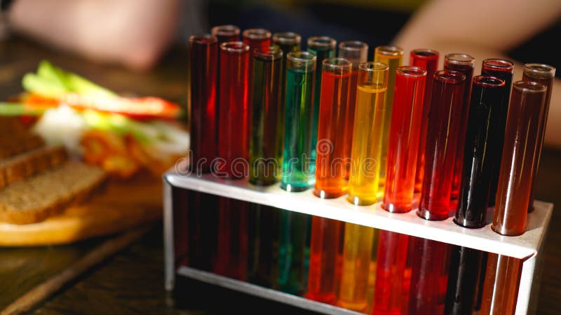 Test Tubes with Multi-colored Liquid. Alcohol in Test Tubes Dark Bar ...