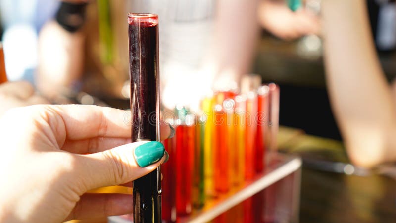 Test Tubes with Multi-colored Liquid. Alcohol in Test Tubes Dark Bar ...