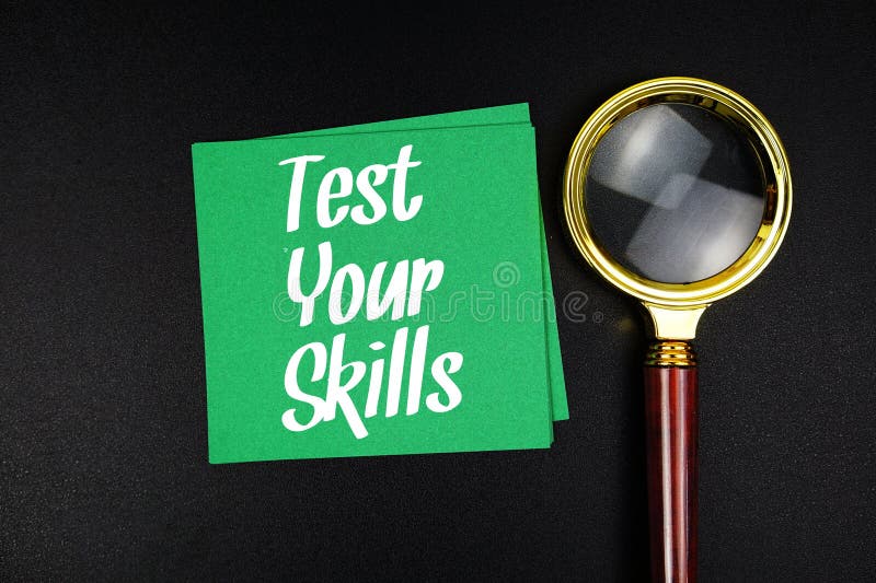 Test Your Skills Text on Sticky Note with Magnifying Glass on Black ...