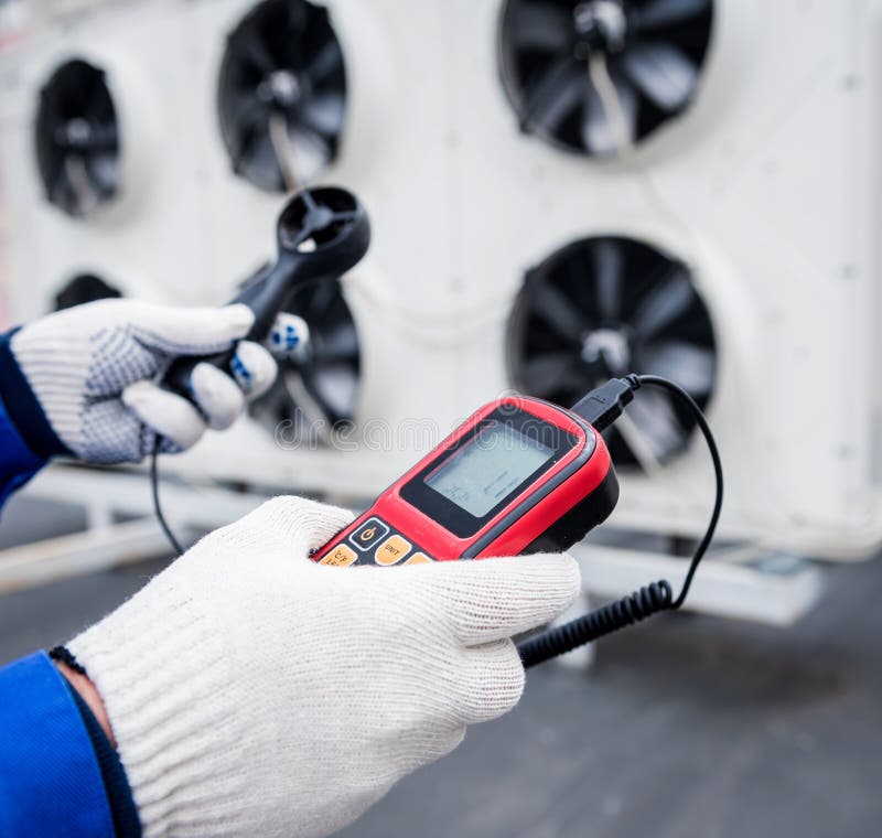 Testing with an Anemometer of an Axial Fan of the Condensing Unit Stock ...