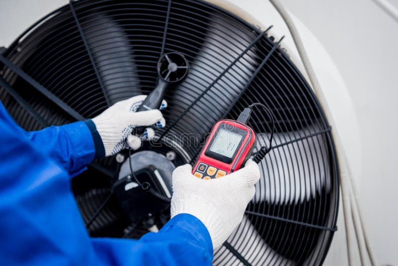 Testing with an Anemometer of an Axial Fan of the Condensing Unit Stock ...