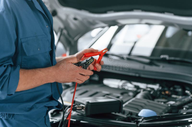 Testing Breakage by Using Electrical Terminals. Man in Blue Uniform is ...