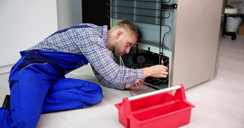 Testing Electric Appliance Using Multimeter To Repair Fridge Stock ...
