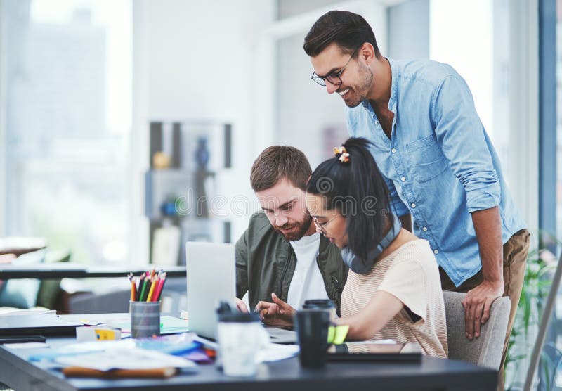 Testing Out a New Mobile App. a Group of Young Designers Working ...