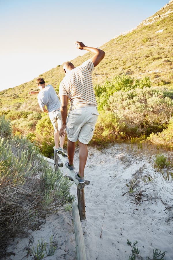 Testing Their Agility. Two Men Walking Across an Obstacle Challenging ...