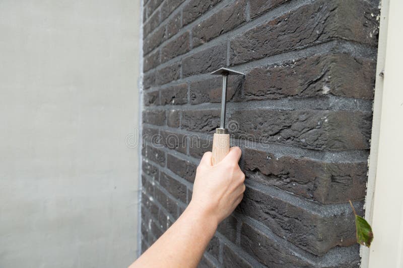 Testing Wall Solidity with Hand Stock Photo - Image of residential ...