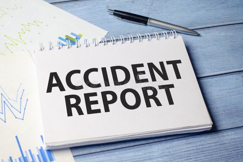 Text ACCIDENT REPORT in a Notebook on a Blue Wooden Desk. View from ...