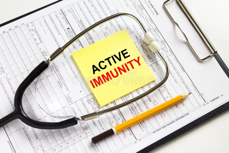 Text Active Immunity on a Yellow Sticker with a Stethoscope Lying on a ...