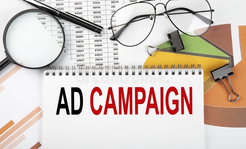 Text AD CAMPAIGN on White Paper Notebook on the Diagram. Business ...