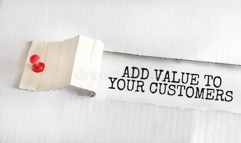 The Text ADD VALUE TO YOUR CUSTOMERS Appearing Behind Torn Yellow Paper ...