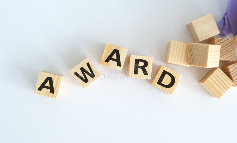 The Text of the AWARD on Wooden Cubes on a Light Background, a Table ...