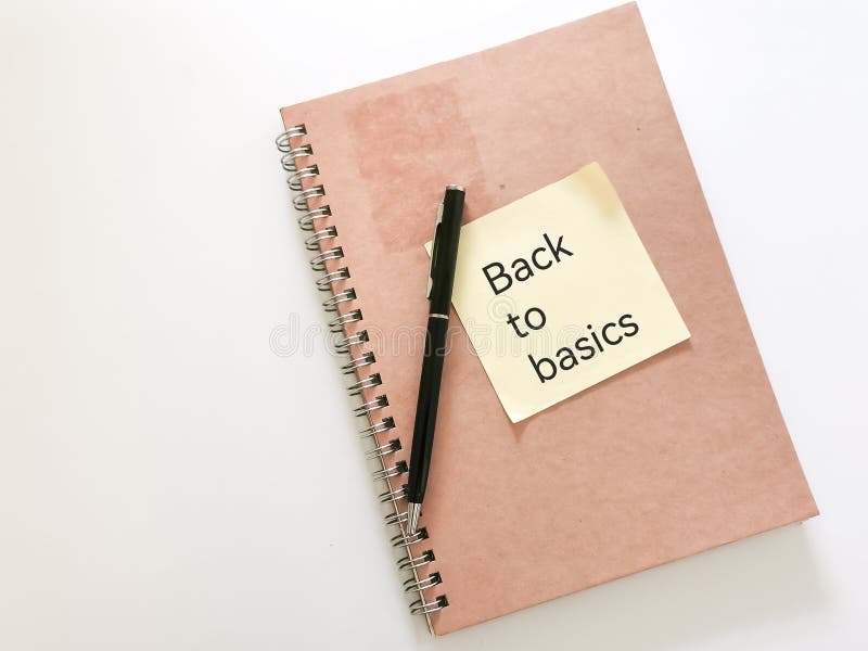Text Back To Basics on Sticky Note with a Pen and Note Book. Stock ...