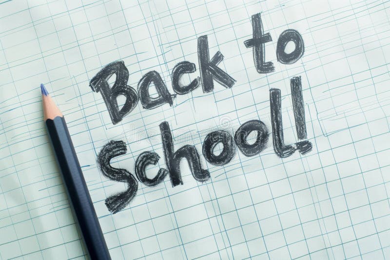 Text Back To School Written on a Grid Piece of Paper with a Pencil Next ...