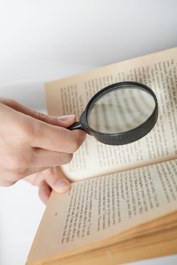 Text in Book is Shown through a Magnifying Glass Stock Photo - Image of ...