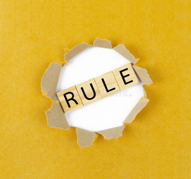 The Text Break the Rules Appearing Behind Ripped Yellow Paper Stock ...