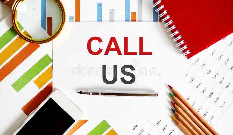 Text CALL US on the Notepad with Office Tools, Pen on Financial Report ...