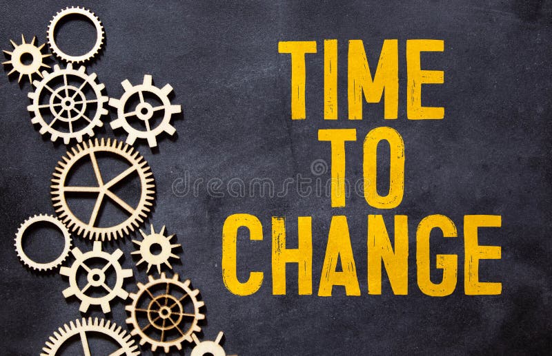 Text CHANGED BUSINESS HOURS Written on Blackboard with Hand Holding ...