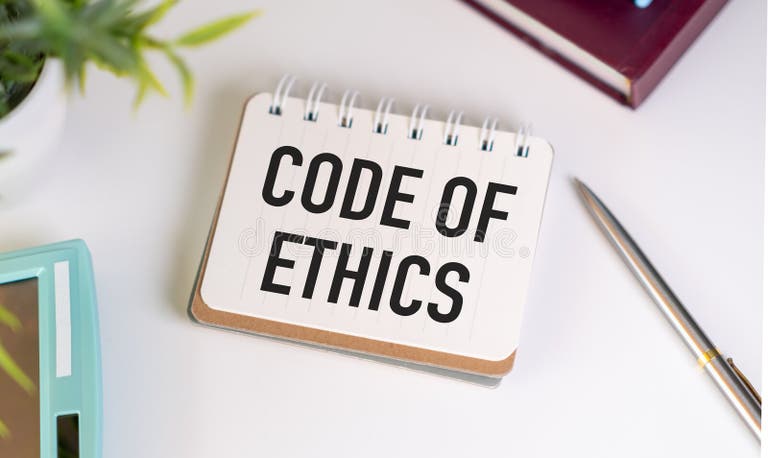 Text Code of Ethics on a White Sticker with Office Stationery ...