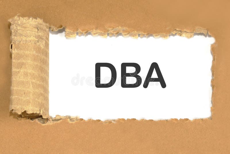 Text DBA on White Paper Under a Torn Piece of Cardboard Stock Photo ...