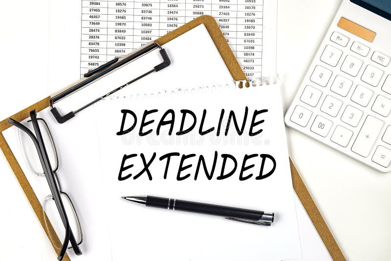 Text DEADLINE EXTENDED on the White Paper on Clipboard with Chart and ...