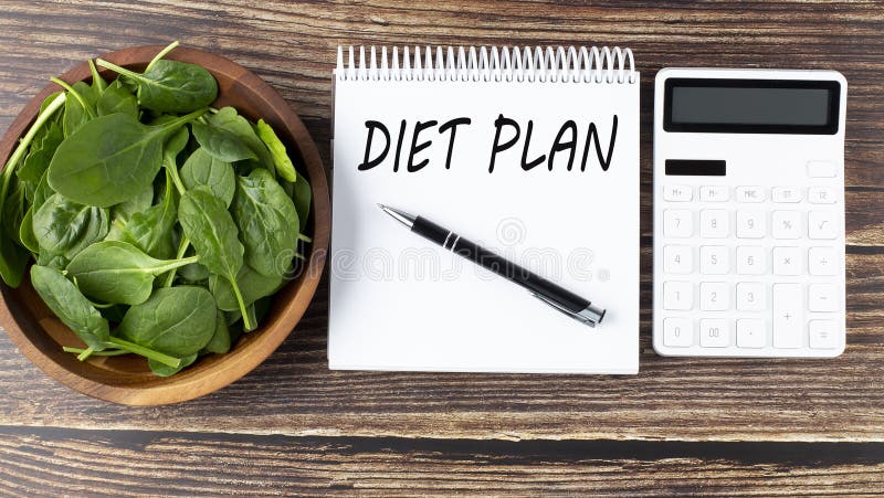 Text Diet Plan on the Notebook with Plate of Spinach and Calculator ...