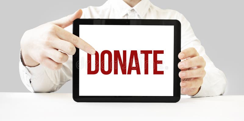 Text DONATE on Tablet Display in Businessman Hands on the White ...