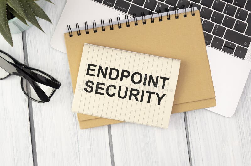 ENDPOINT SECURITY on Brown Paper Notepad in Businessman Hands in Office ...