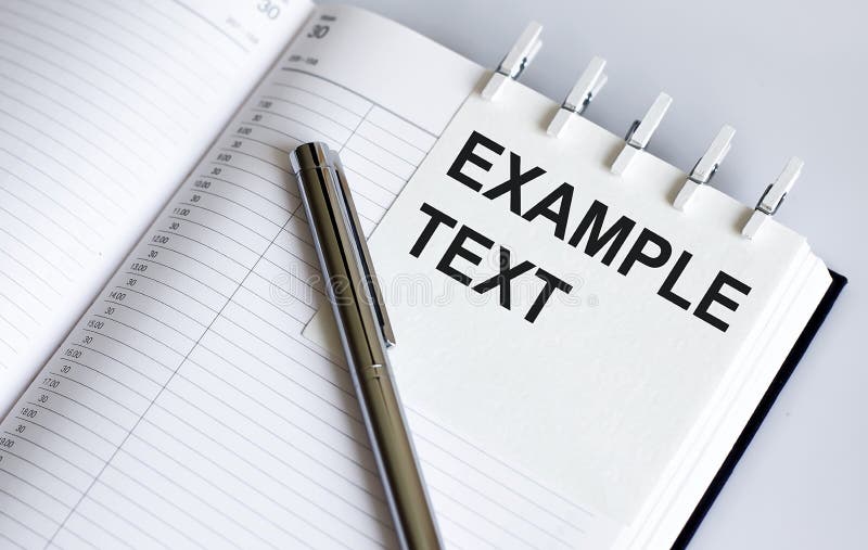 Text EXAMPLE TEXT on the Short Note Texture Background with Pen Stock ...