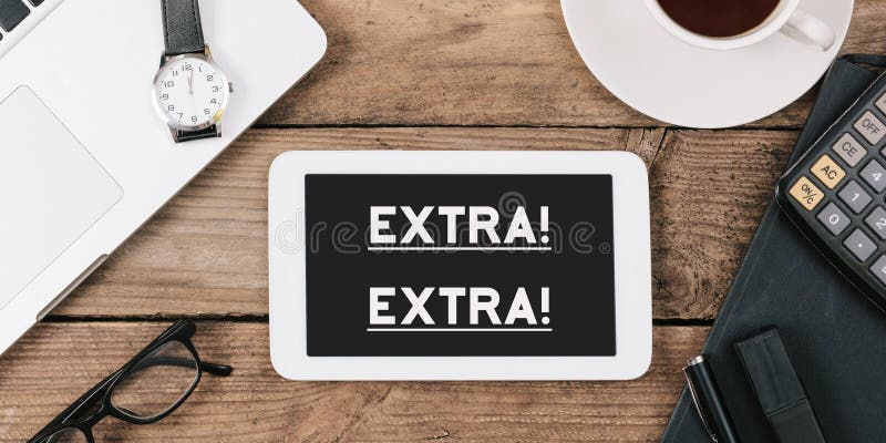 Text Extra! Extra! on Screen of Table Computer at Office Desk Stock ...