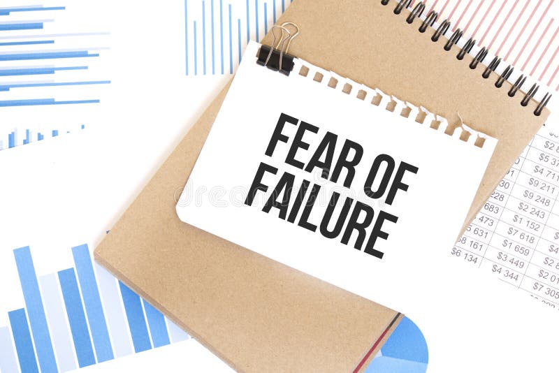 Text Fear of Failure on White Paper Sheet and Brown Paper Notepad on ...
