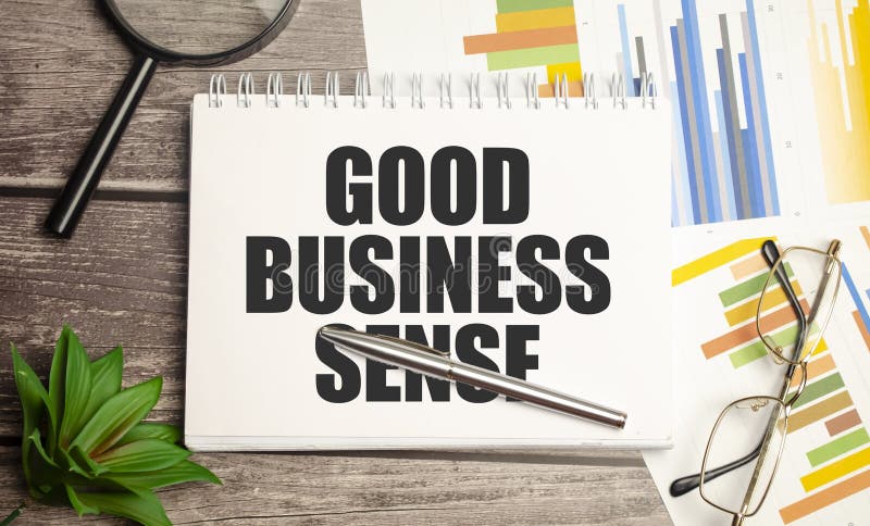 Text GOOD BUSINESS SENSE on a Notepad with Magnifier , Glasses and Pen ...