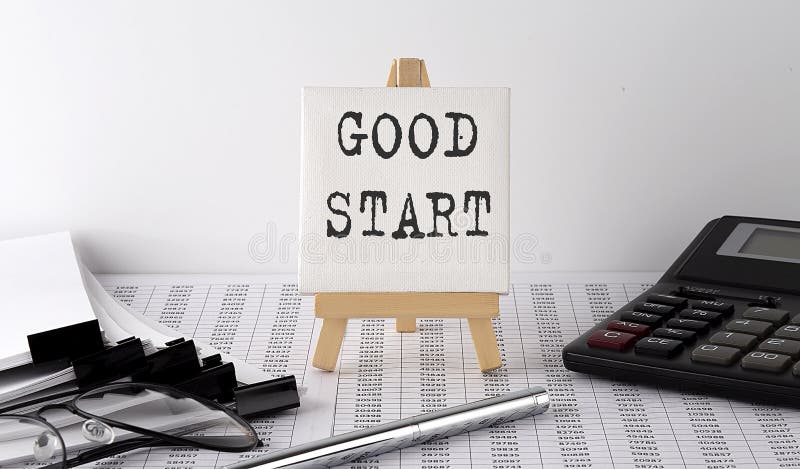 Text GOOD START on Easel with Office Tools and Paper.Top View Stock ...
