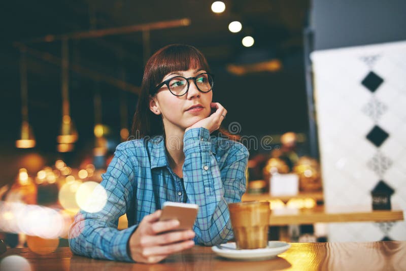 This Text Has Got Her Thinking...an Attractive Young Woman Looking ...