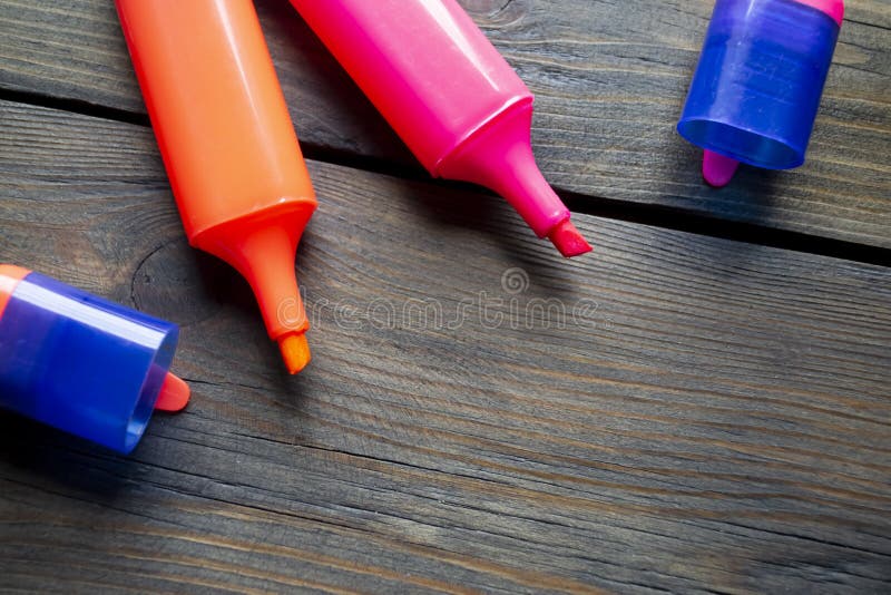 On the Table are Markers, Paper Clips and a Notebook with the ...