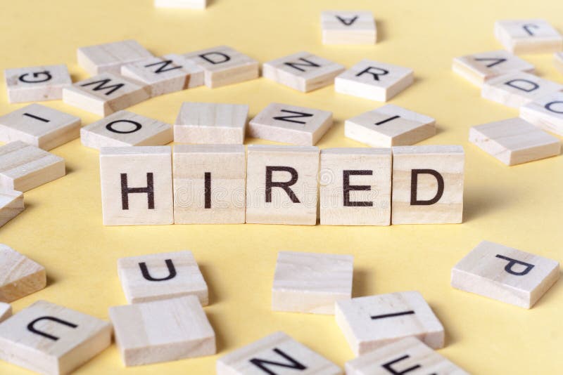 Text of HIRED on Cubes. Wooden Abc Stock Photo - Image of message ...
